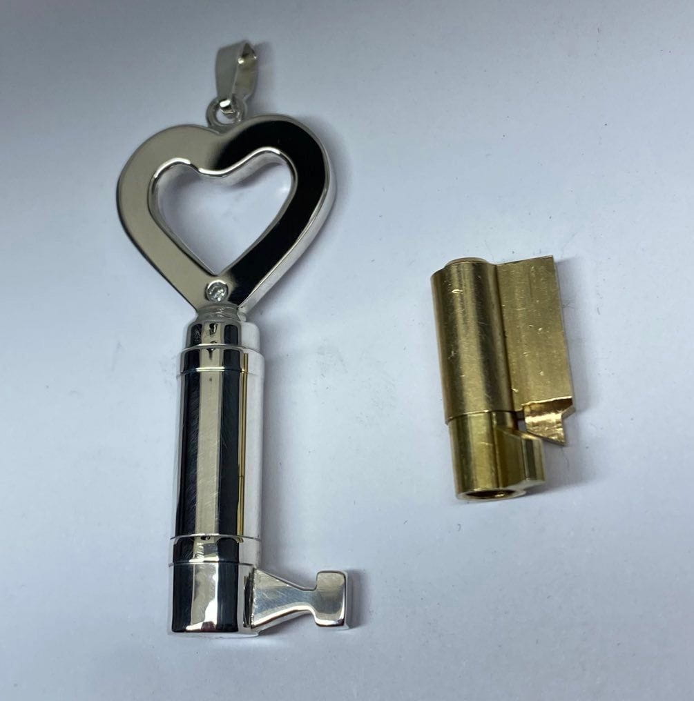 The Secret handmade silver chastity key | chastity-shop