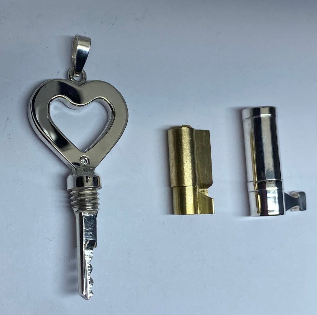 The Secret handmade silver chastity key | chastity-shop